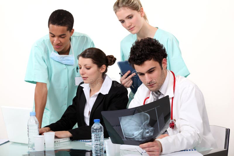 Multiethnic Medical Research Team Working at Desk Stock Image - Image ...