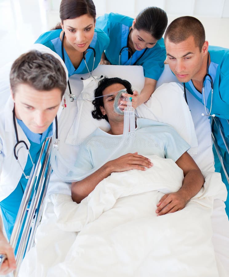 Medical Team Carrying a Patient Stock Photo - Image of clinic ...