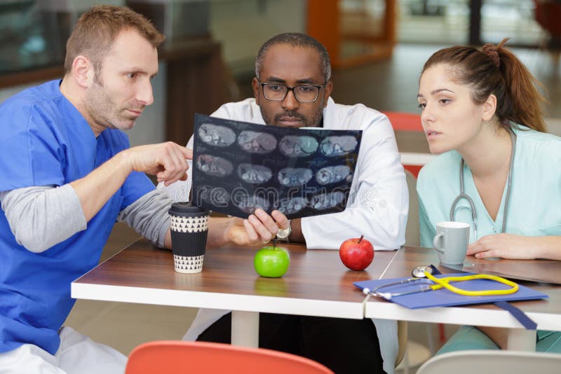 Medical Team Checking Xray Results Stock Photo - Image of male ...