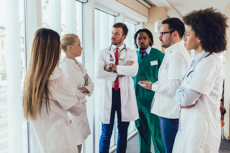 Medical Team Discussing in the Office Stock Image - Image of black ...