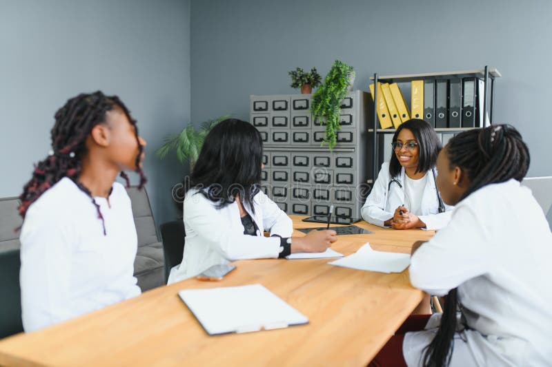Medical Team Discussing Treatment Options with Patients. Stock Photo ...