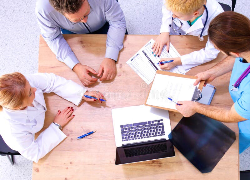 Medical Team Discussing Treatment Options with Patients Stock Photo ...