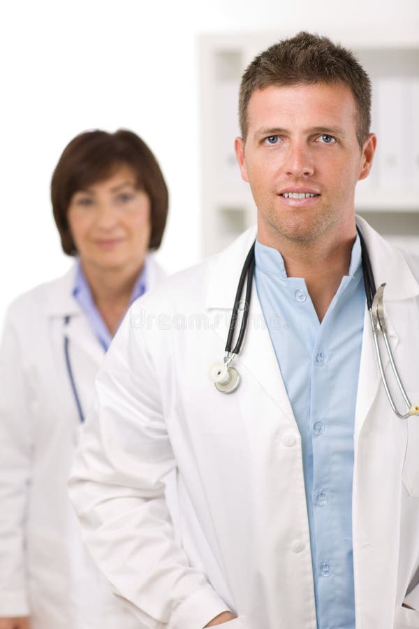 Two Medical Doctors Consulting Stock Photo - Image of collaboration ...