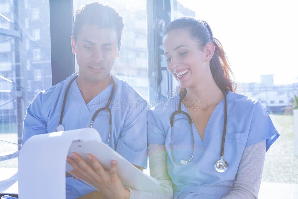 Medical Team Interacting Notepad Stock Image - Image of notepad, head ...