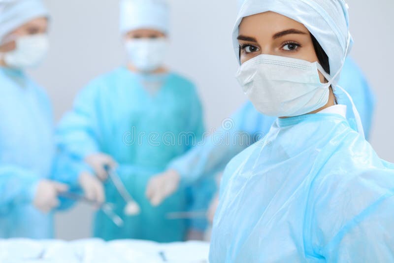 Medical Team Performing Operation. Focus at Female Doctor Stock Photo ...
