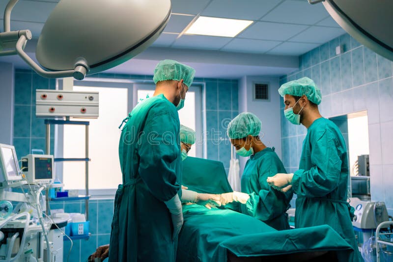 Group of Surgeon Team at Work in Operating Room in Hospital Stock Photo ...