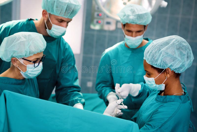 Group of Surgeon Team at Work in Operating Room in Hospital Stock Photo ...