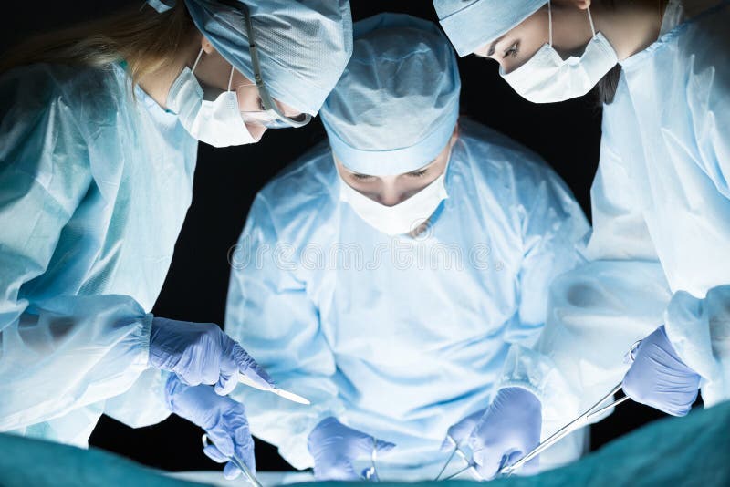Medical Team Performing Operation Stock Image - Image of hospital ...