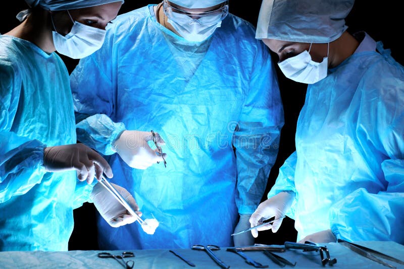 Medical Team Performing Operation. Group of Surgeon at Work in ...