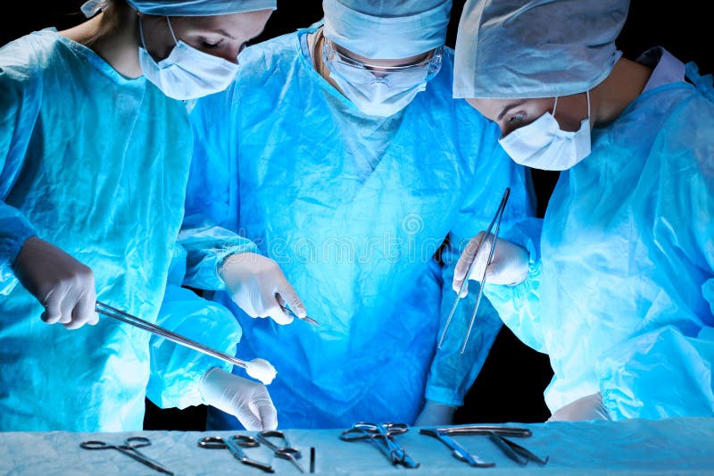 Medical Team Performing Operation. Group of Surgeon at Work in ...