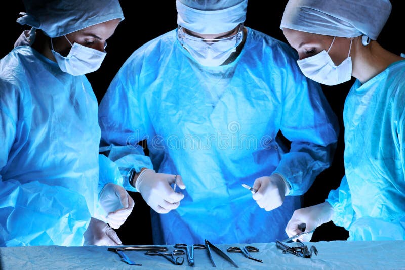 Medical Team Performing Operation. Group of Surgeon at Work in ...