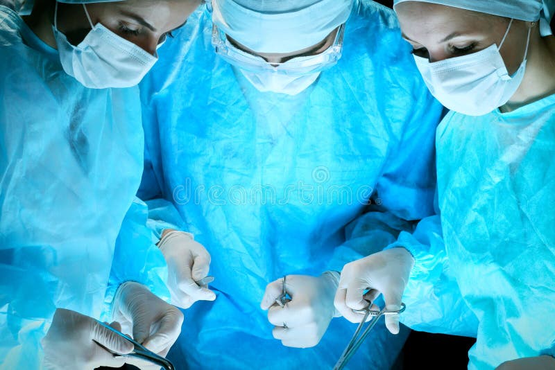 Medical Team Performing Operation. Group of Surgeon at Work in ...