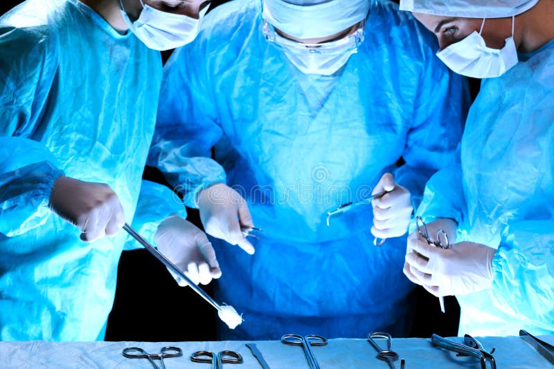 Medical Team Performing Operation. Group of Surgeon at Work in ...