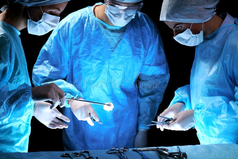 Medical Team Performing Operation. Group of Surgeon at Work in ...