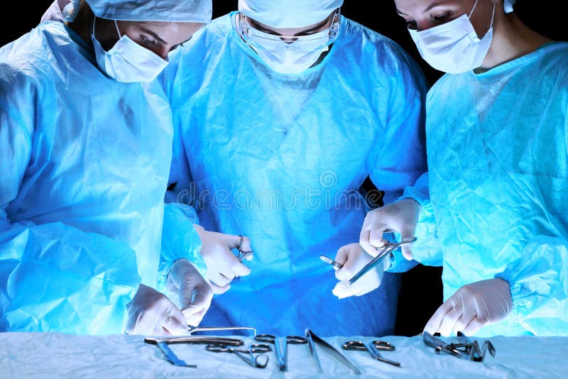 Medical Team Performing Operation. Group of Surgeon at Work in ...