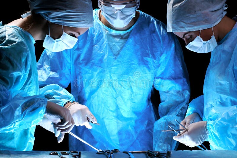 Medical Team Performing Operation. Group of Surgeon at Work in ...