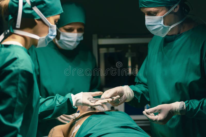 Medical Team Performing Surgery in Operation Room Stock Image - Image ...