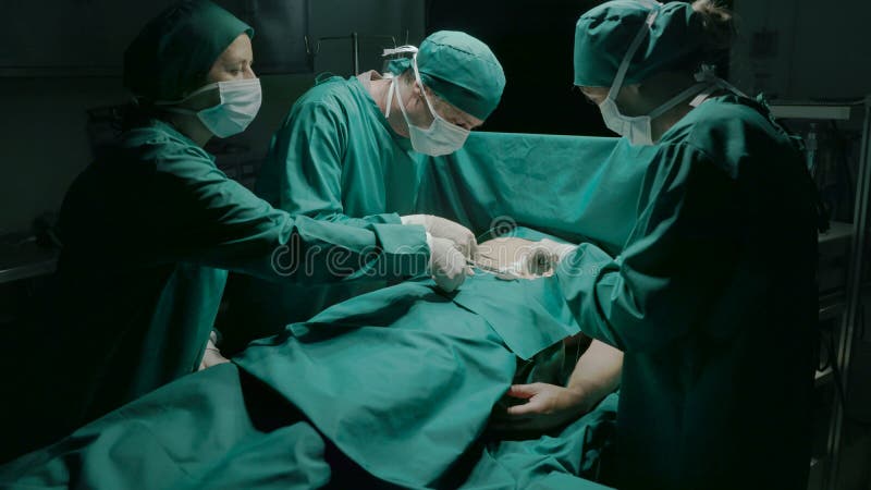 Medical Team Performing Surgery in Operation Room Stock Image - Image ...