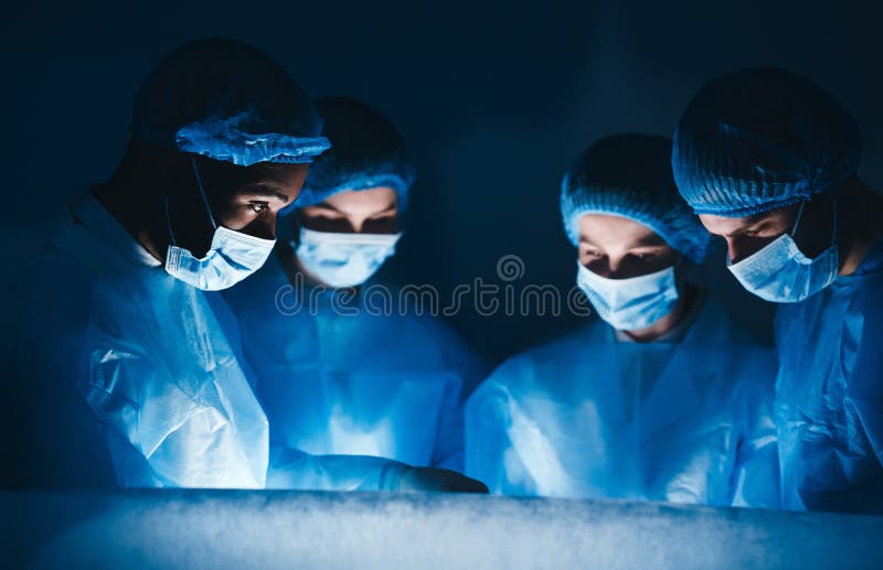 Medical Team Performing Surgical Operation Dark Room Stock Photos ...