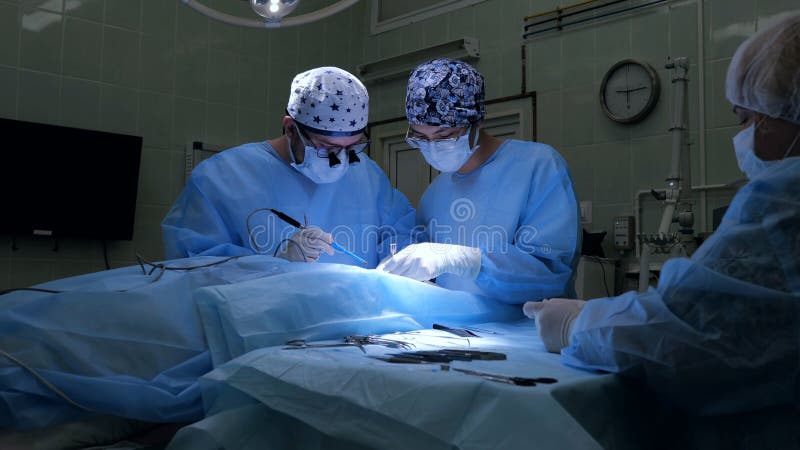 Medical Team Performing a Surgical Operation in a Modern Operating Room ...
