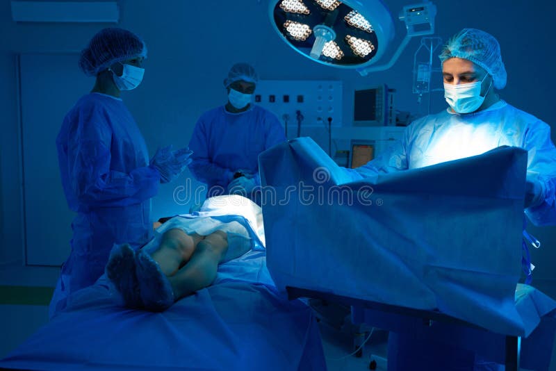 Medical Team Performing Surgical Operation in Operating Room Stock ...