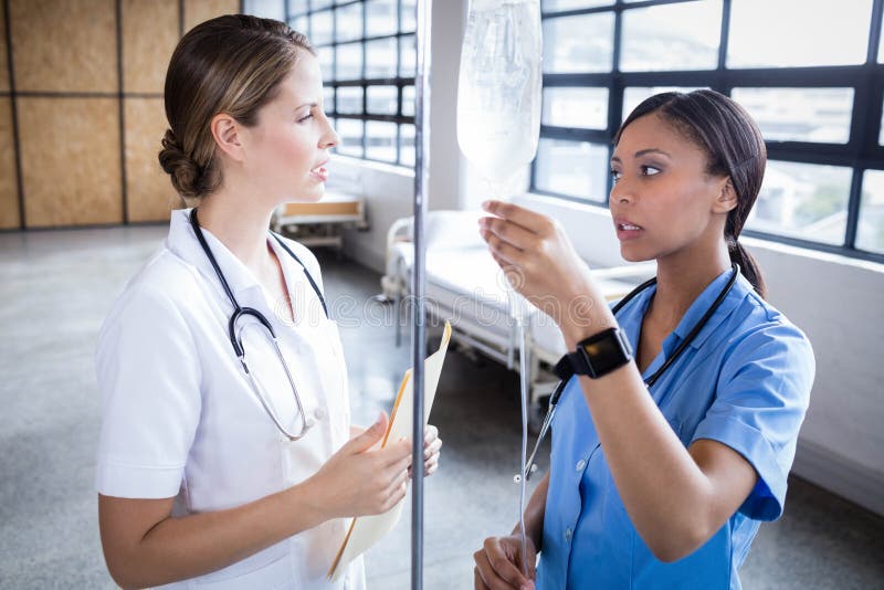 Medical Team Preparing an IV Drip Stock Photo - Image of drip, nurse ...