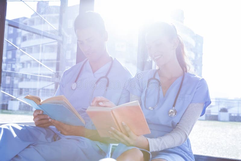 Medical team reading book stock image. Image of book - 67725819