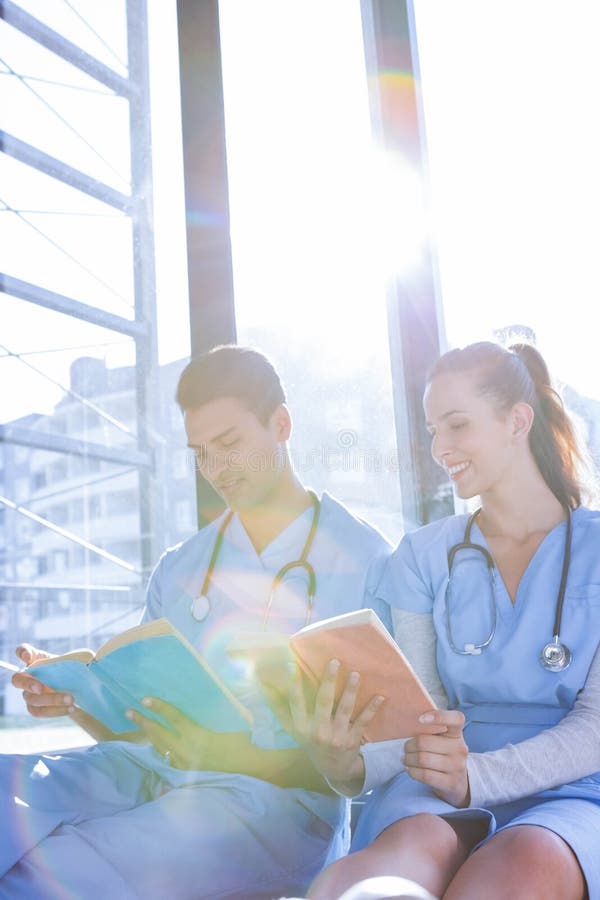 Medical team reading book stock image. Image of employees - 67725821