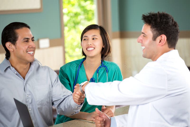 Medical Team Talking with Patients. Stock Image - Image of insurance ...