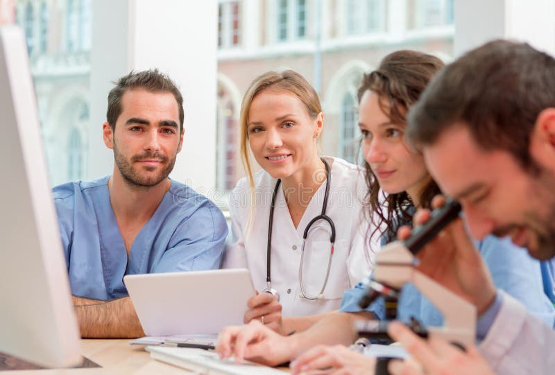 Medical Team Working at the Hospital All Together Stock Image - Image ...