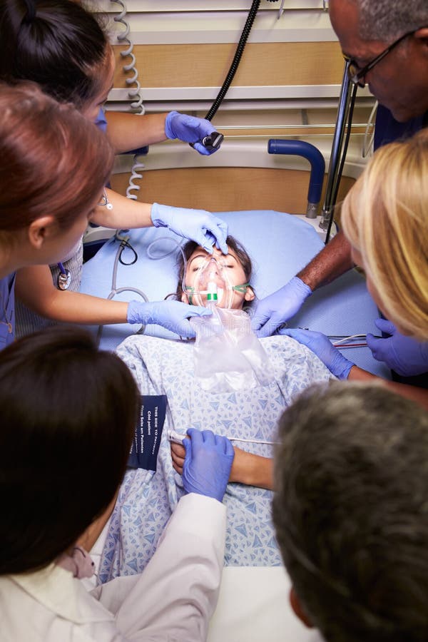 Medical Team Working on Patient in Emergency Room Stock Image - Image ...