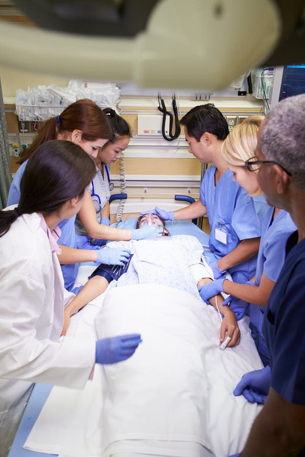 Medical Team Working on Patient in Emergency Room Stock Image - Image ...