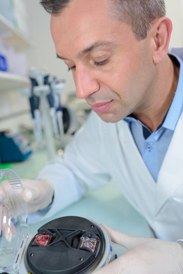 Medical Technician Opening Machine Stock Image - Image of hand, open ...