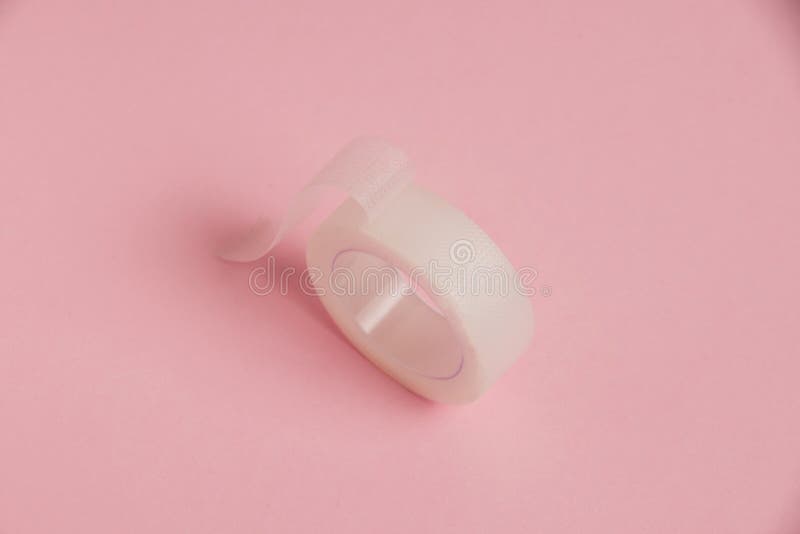 Medical Transparent Patch for Applying Bandages on a Pink Background ...