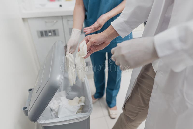 Medical Waste Disposal by the Professionals in a Surgery Room Stock ...