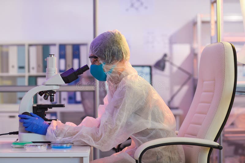 Medical Worker Using Microscope at Work Stock Image - Image of looking ...
