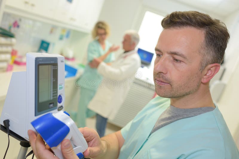 Medical Worker Setting Up Machine Stock Image - Image of hospital ...