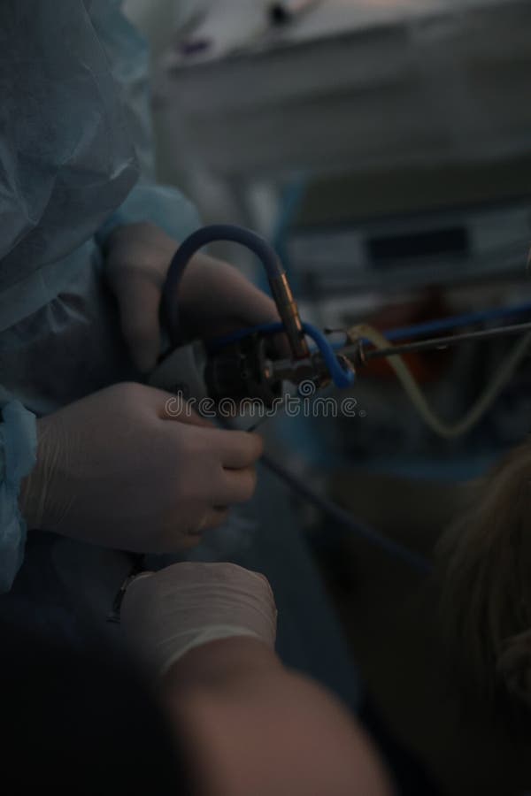 Medical Workers Perform a Minimum Invasive Surgical Procedure Using ...