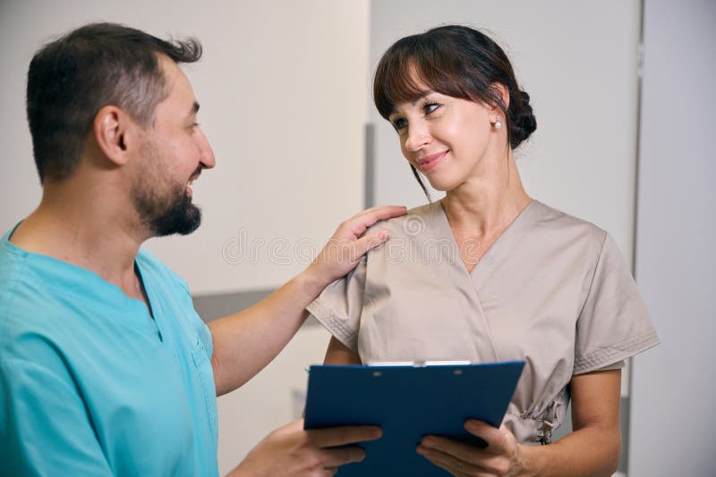 Medical Workers Talking in Medical Center Corridor Stock Photo - Image ...