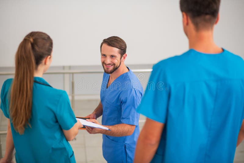 Medical Workers Talking in the Hospital Hall Stock Image - Image of ...
