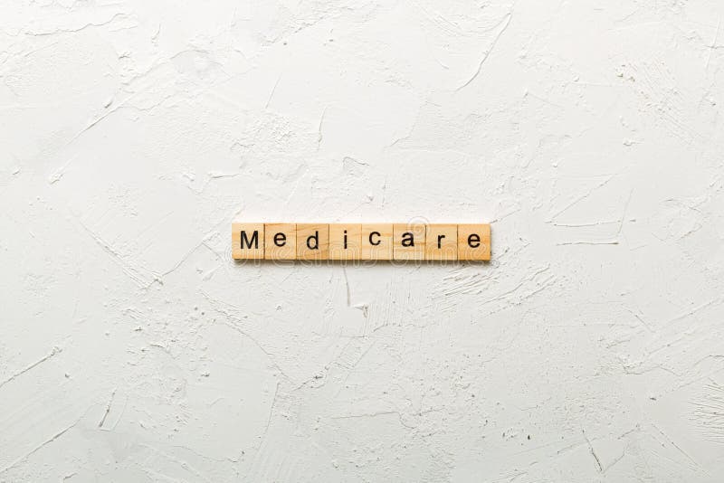 Medicare Word Written on Wood Block. Medicare Text on Table, Concept ...