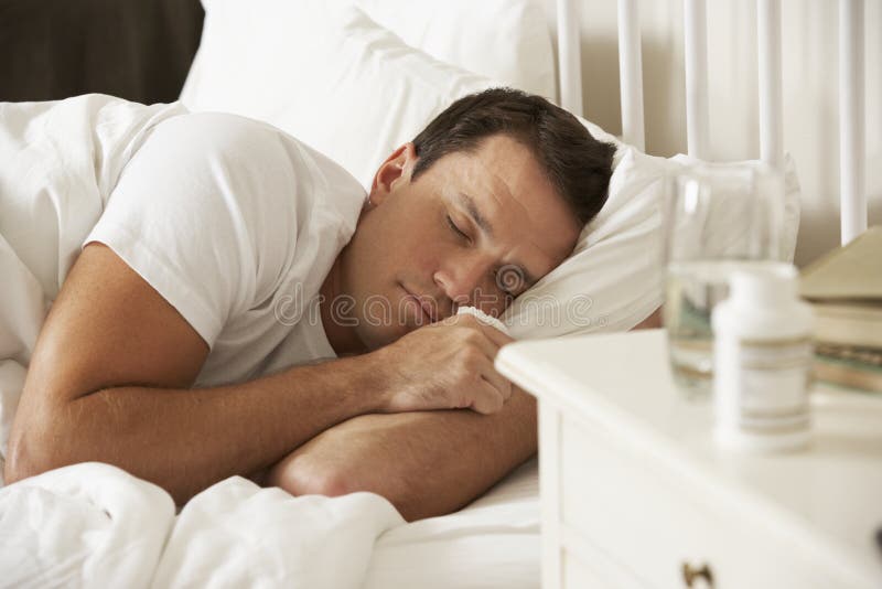 Medication on Bedside Table of Sleeping Woman Stock Photo - Image of ...