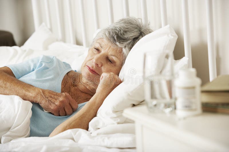 Medication on Bedside Table of Sleepless Senior Woman Stock Photo ...