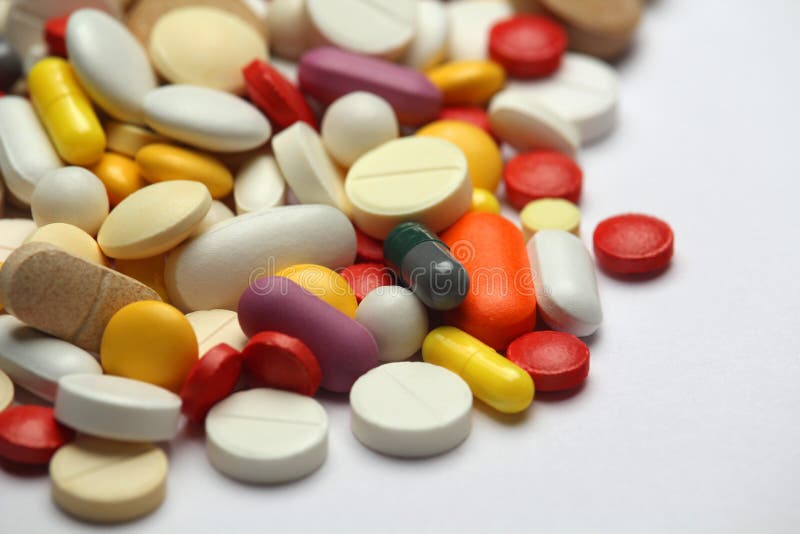 Different Colorful Tablets at White Background Stock Photo - Image of ...