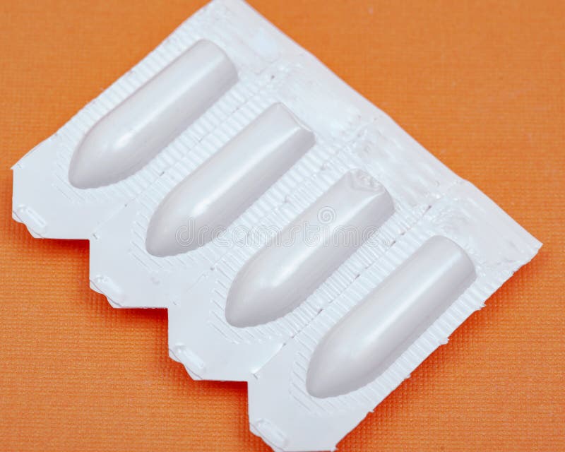 Medication in Disposable Plastic Suppository Moulds on Orange. Rectal ...