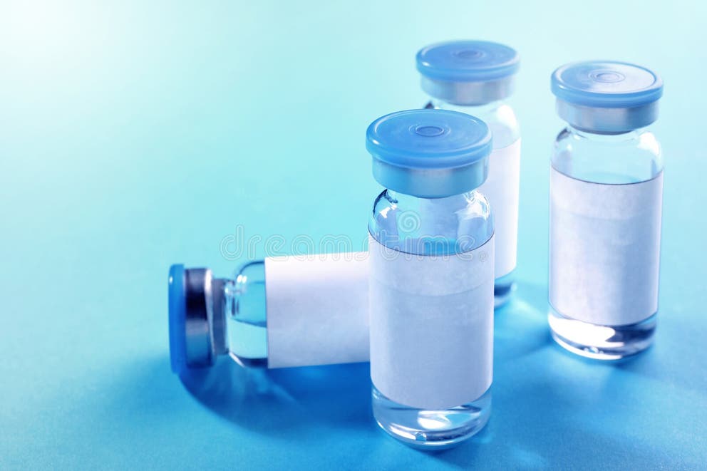 Medication in Glass Vials with Blank Labels on Light Blue Background ...