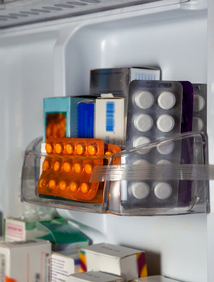 Medications are Placed on the Shelves of the Refrigerator for Storage ...
