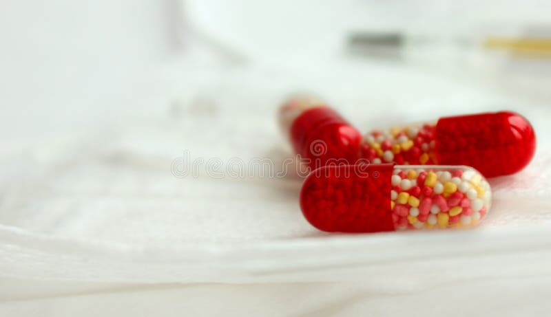 Medications are Placed on a White Background at Close Range. Red and ...