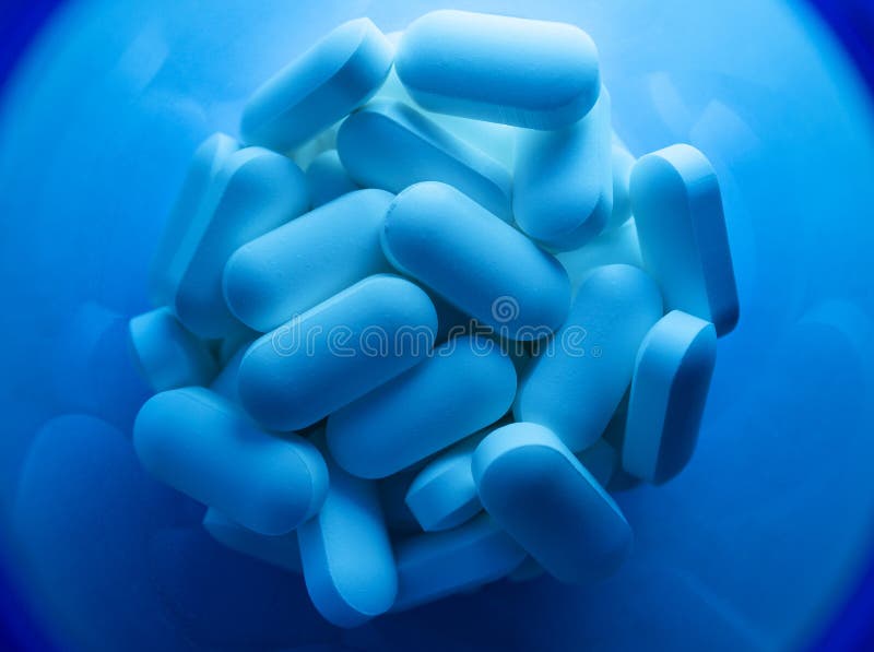 Medicinal Pills they are Located Inside the Blue Bottle Container Close ...