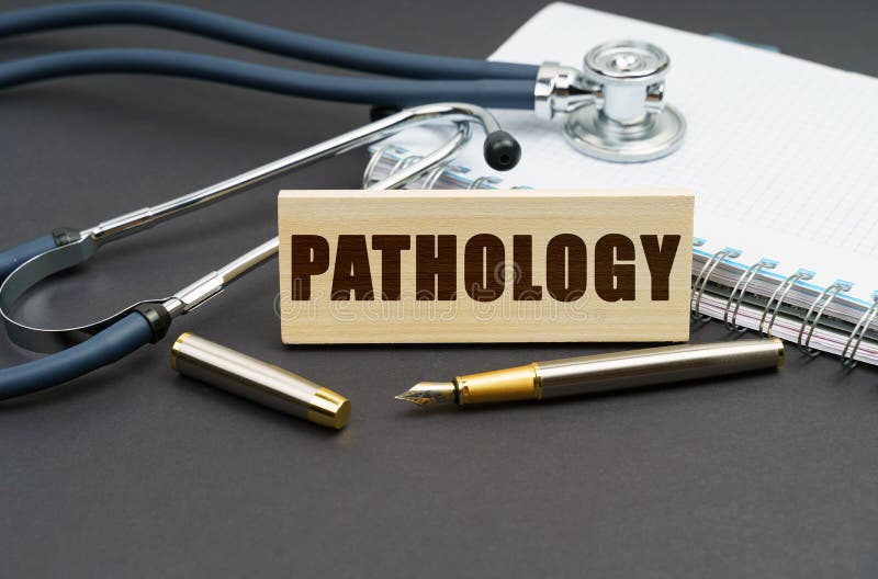 On the Table is a Notebook, a Stethoscope and a Sign with the ...